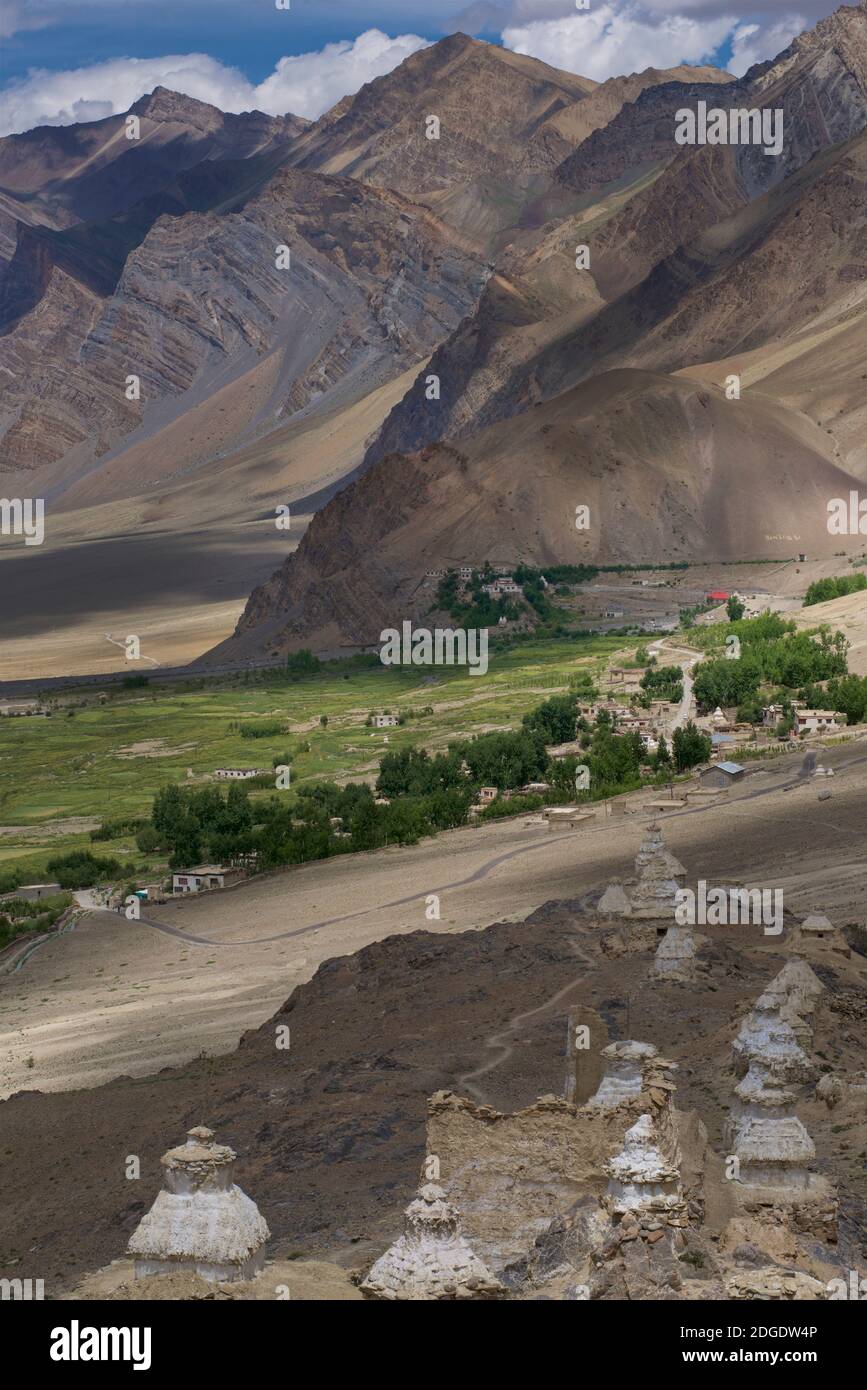 Stupas scattered on the hillside beneath Zangla Palace, Tsa-zar ...
