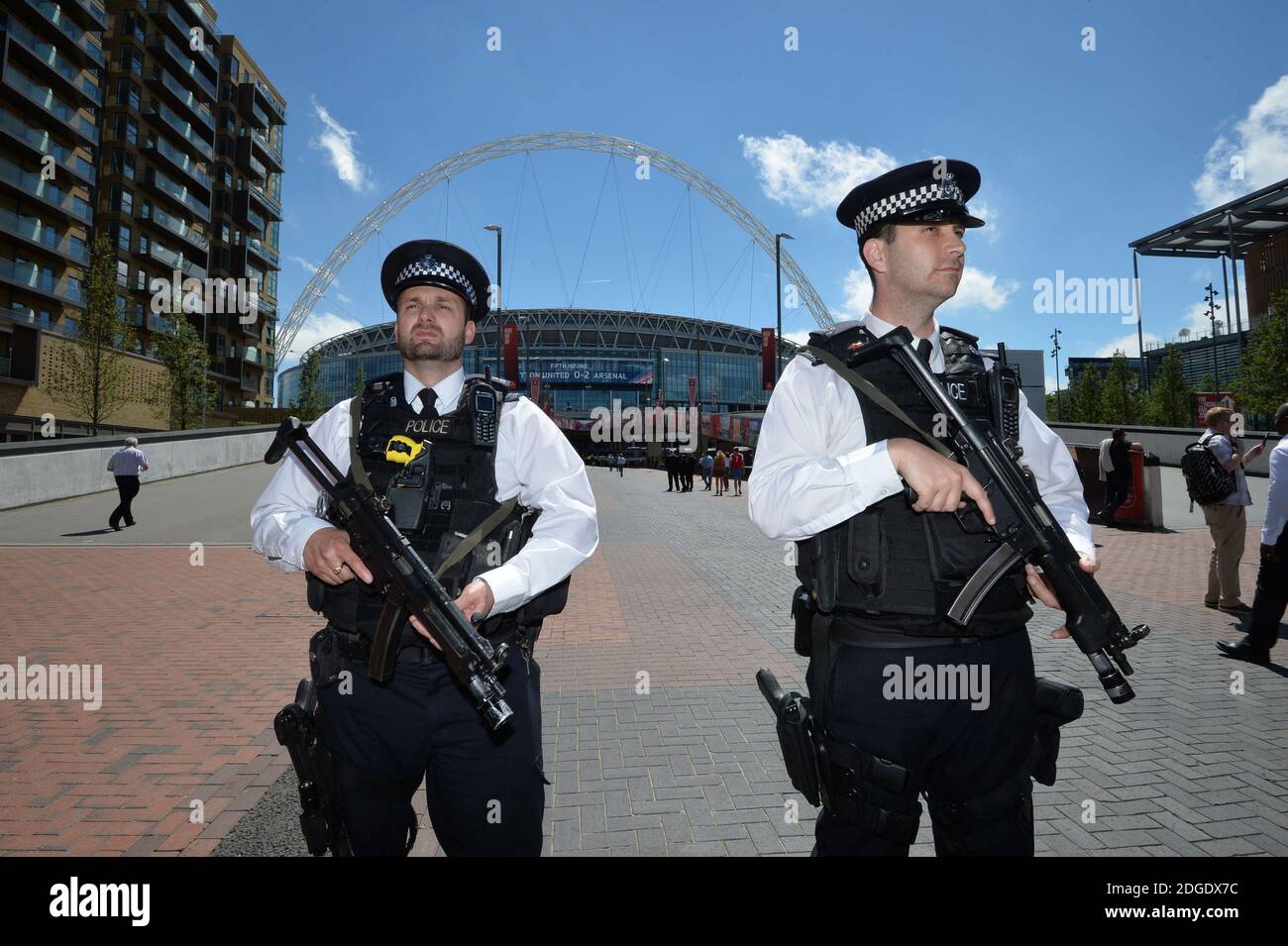 Armed police officers patrol outside Wembley Stadium ahead of the FA ...