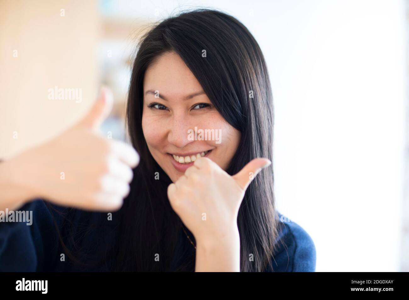 young woman asia female with long hair making hand signs Stock Photo ...