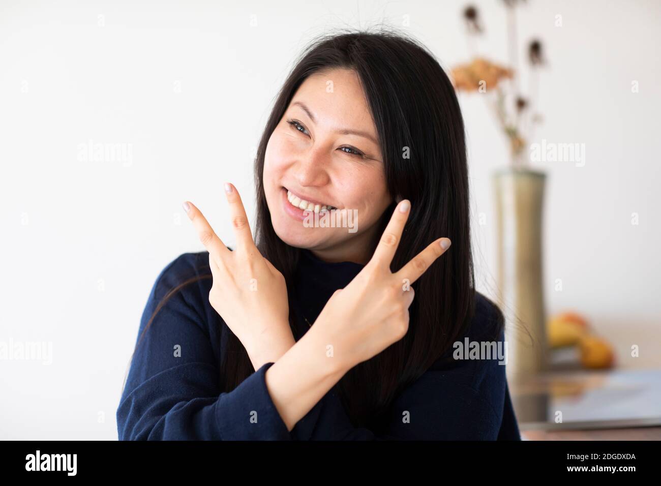 young woman asia female with long hair making hand signs Stock Photo ...