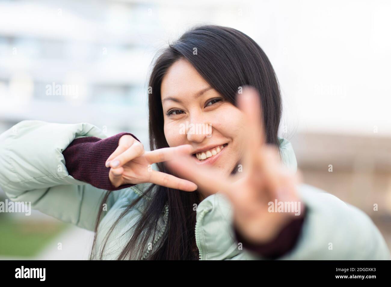 young woman asia female with long hair making hand signs Stock Photo ...