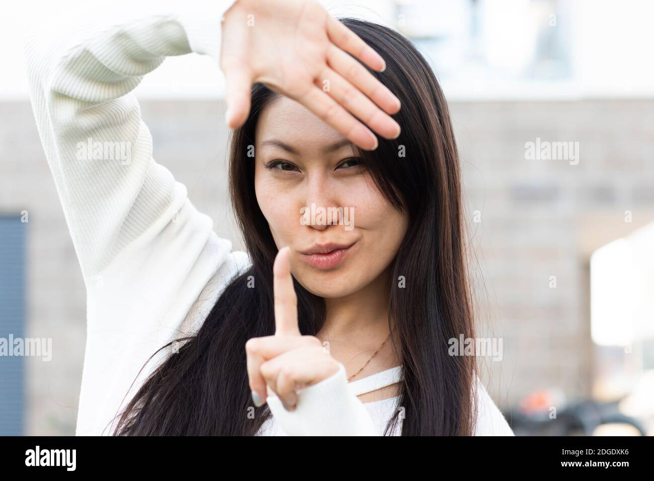 young woman asia female with long hair making hand signs Stock Photo ...