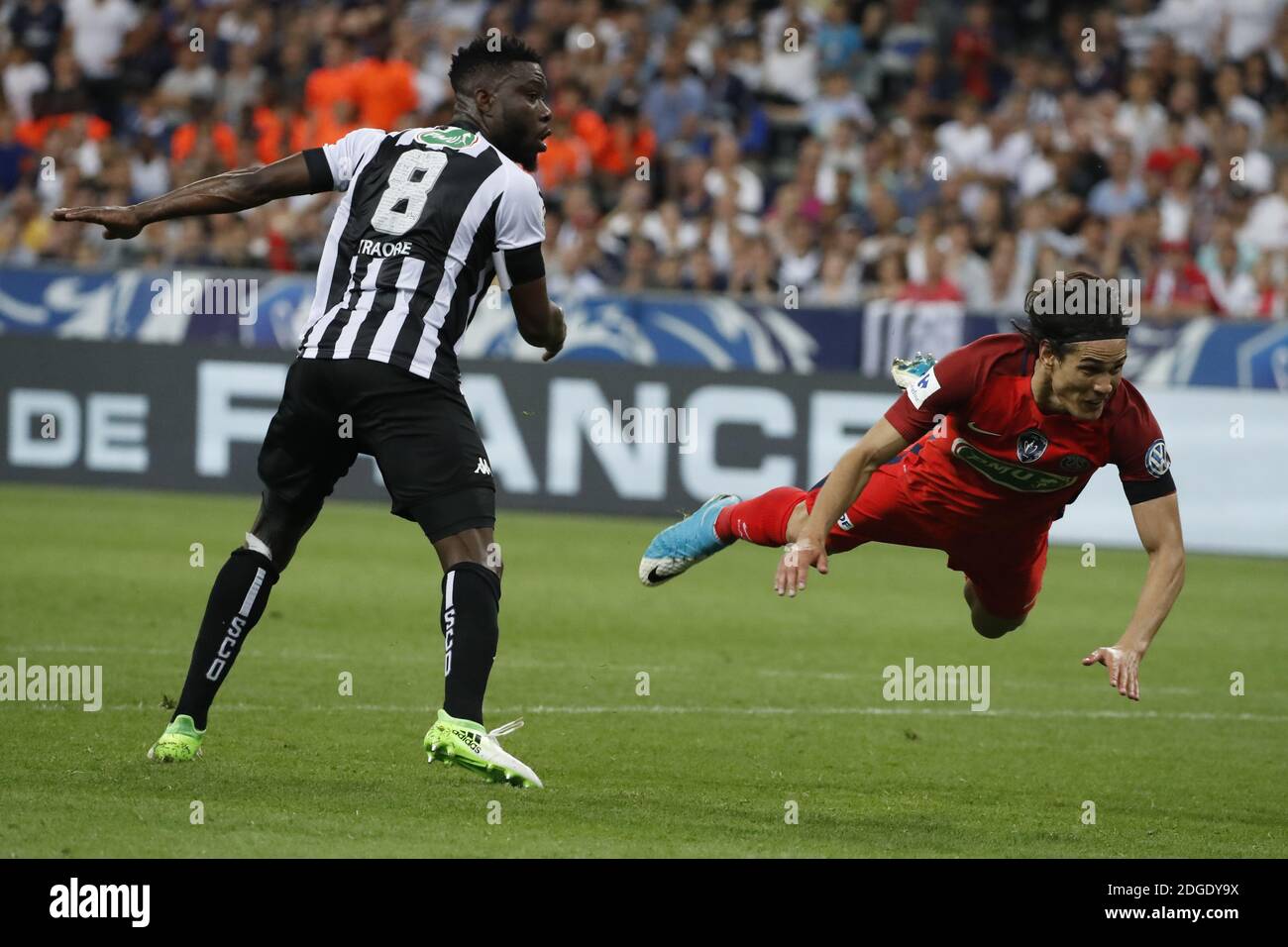 PSG's Edinson Cavani battling Angers's Ismael Traore during the French ...