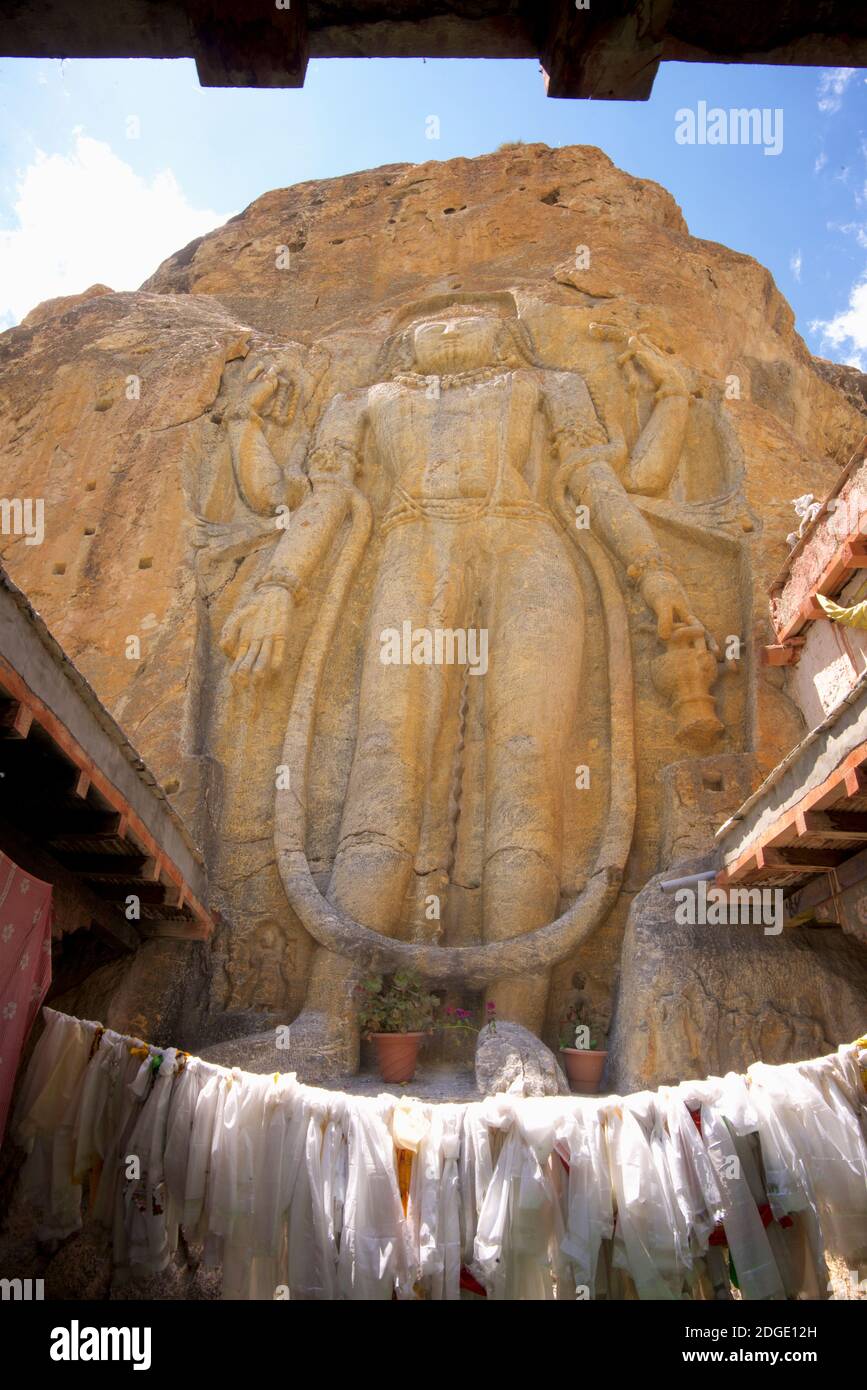 Rock carved giant 8th century statue of Maitreya Buddha at Mulbekh ...