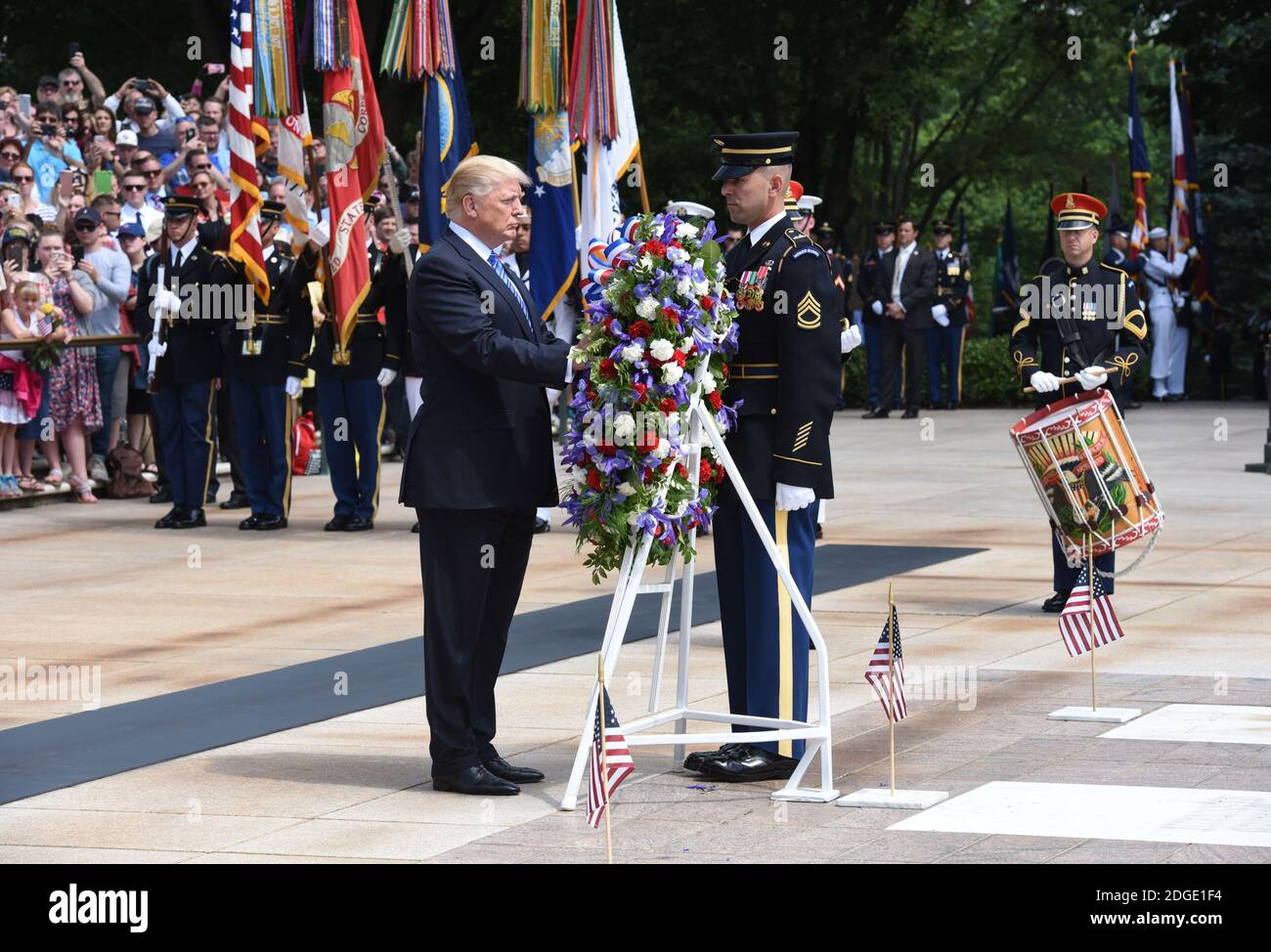 President Donald Trump participates in a wreath-laying ceremony at the ...