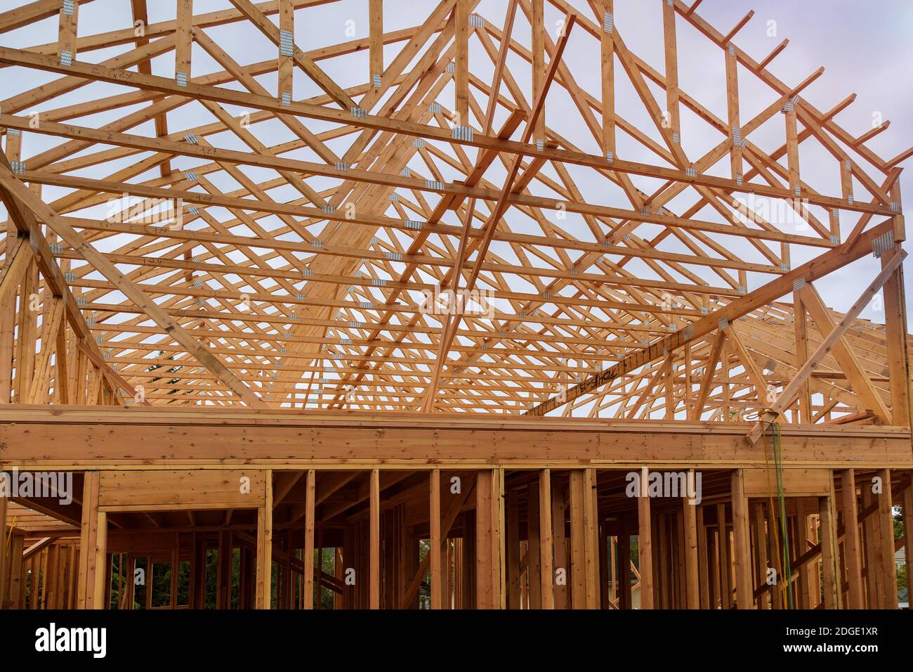 Wooden house roof residential construction home framing Stock Photo - Alamy