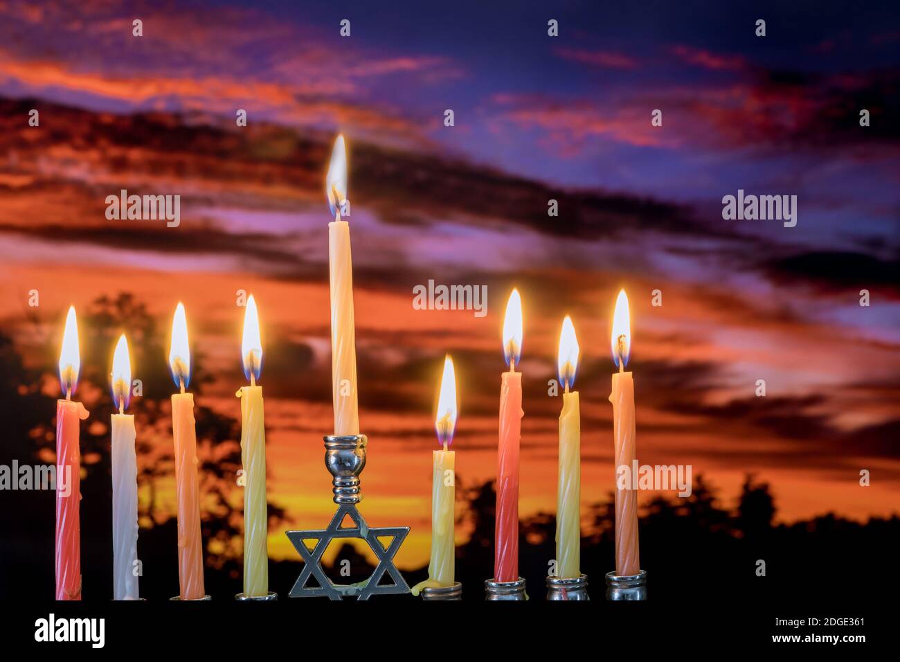 Chanukah Menorah in the Jewish festival of lights beautiful sky with ...