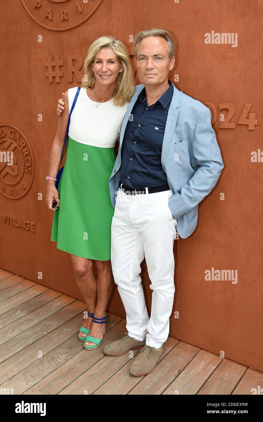 Gilles Cohen and his wife posing at the Village during French Tennis ...