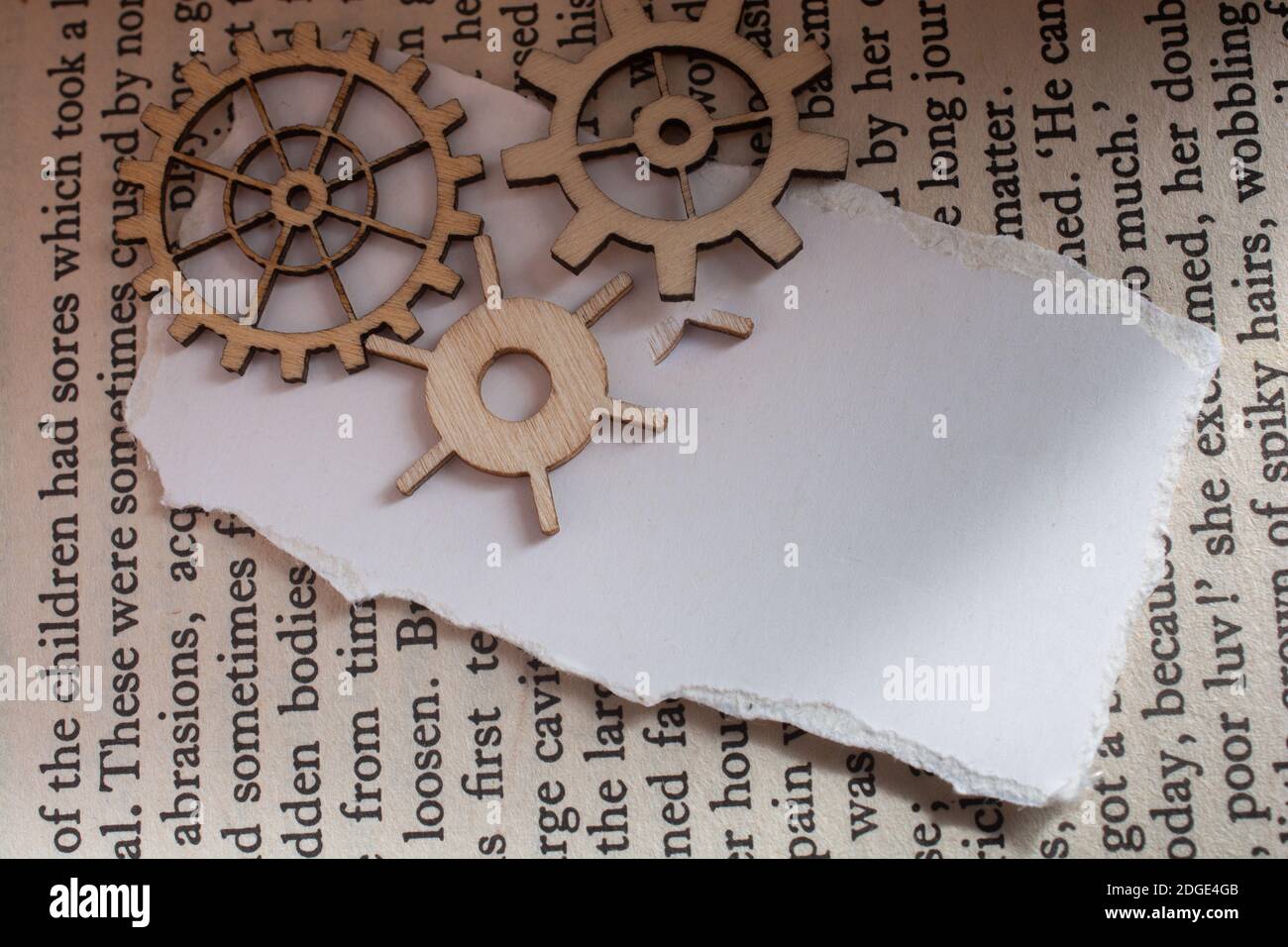 The concept of business gear wheels placed on book page Stock Photo - Alamy
