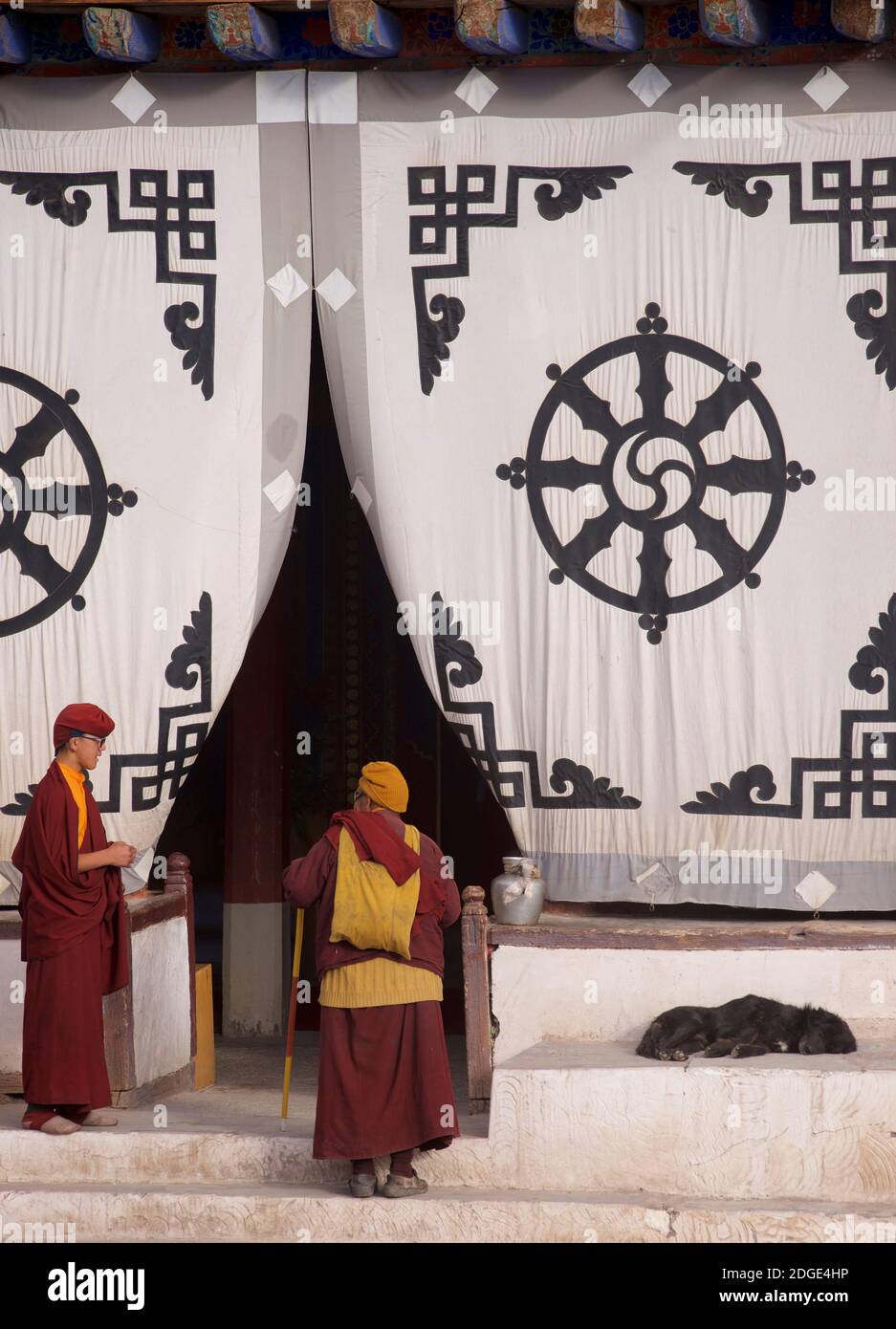 Early morning at Hemis monastery. Monks outside the prayer hall. Hemis ...