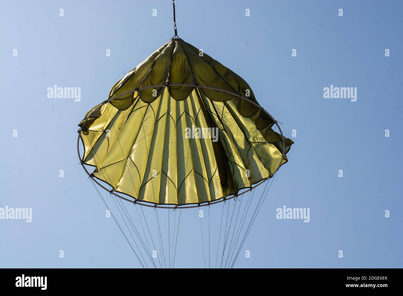 Parachuting sport concept. Skydiver descending with a parachute Stock ...