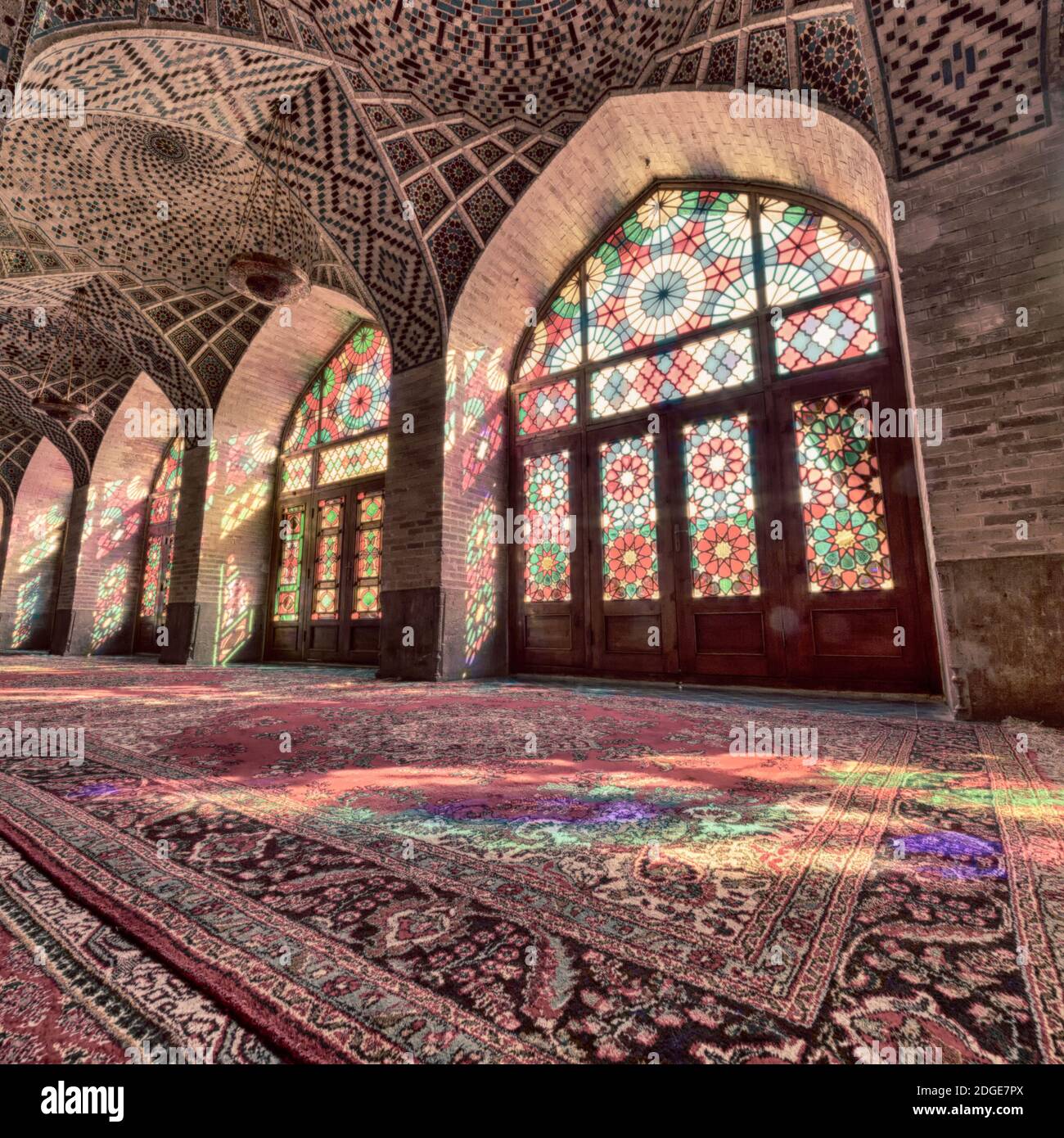 Interior with colored light from stained glass windows hi-res stock ...