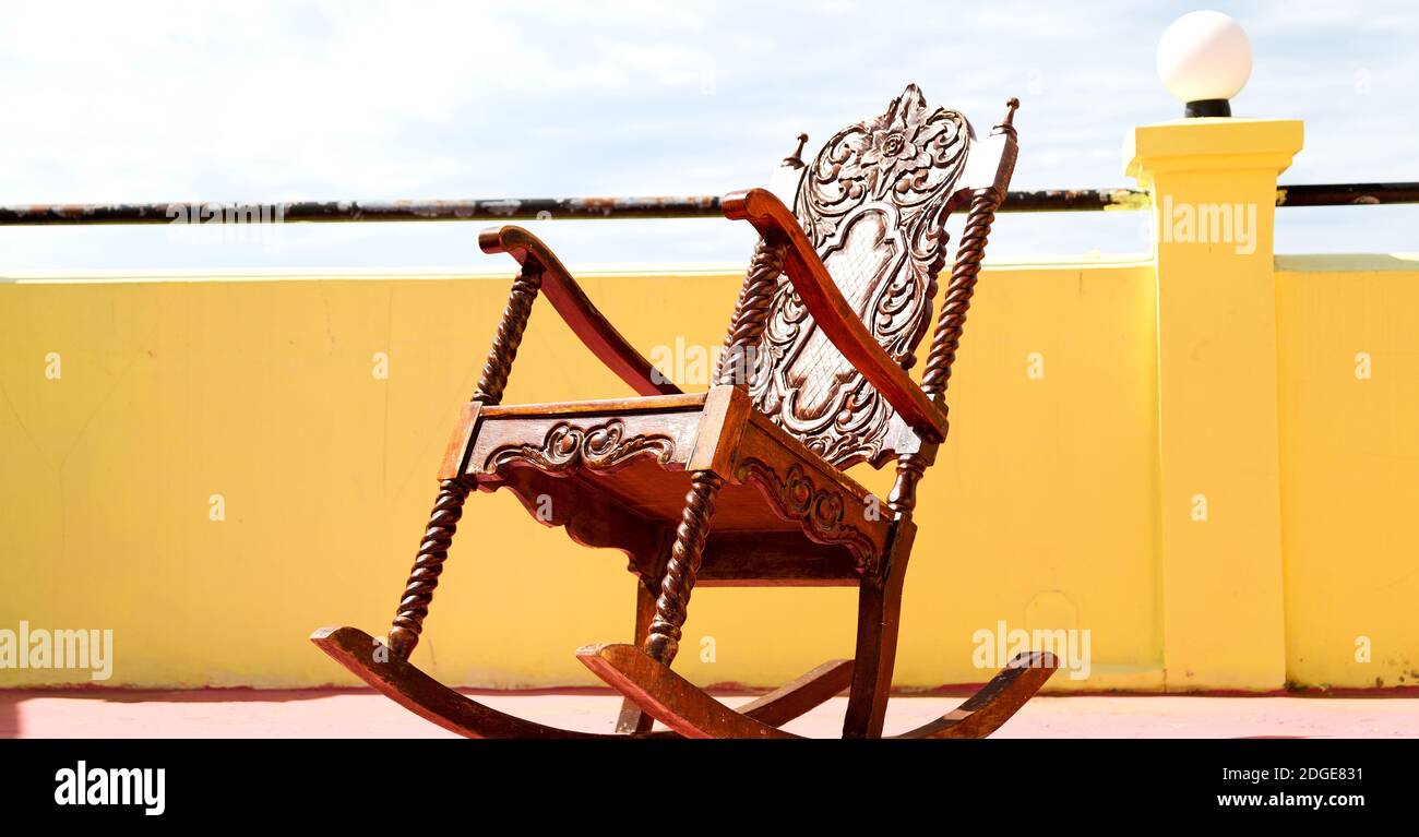 Old dirty terrace whith rocking chair empty Stock Photo - Alamy