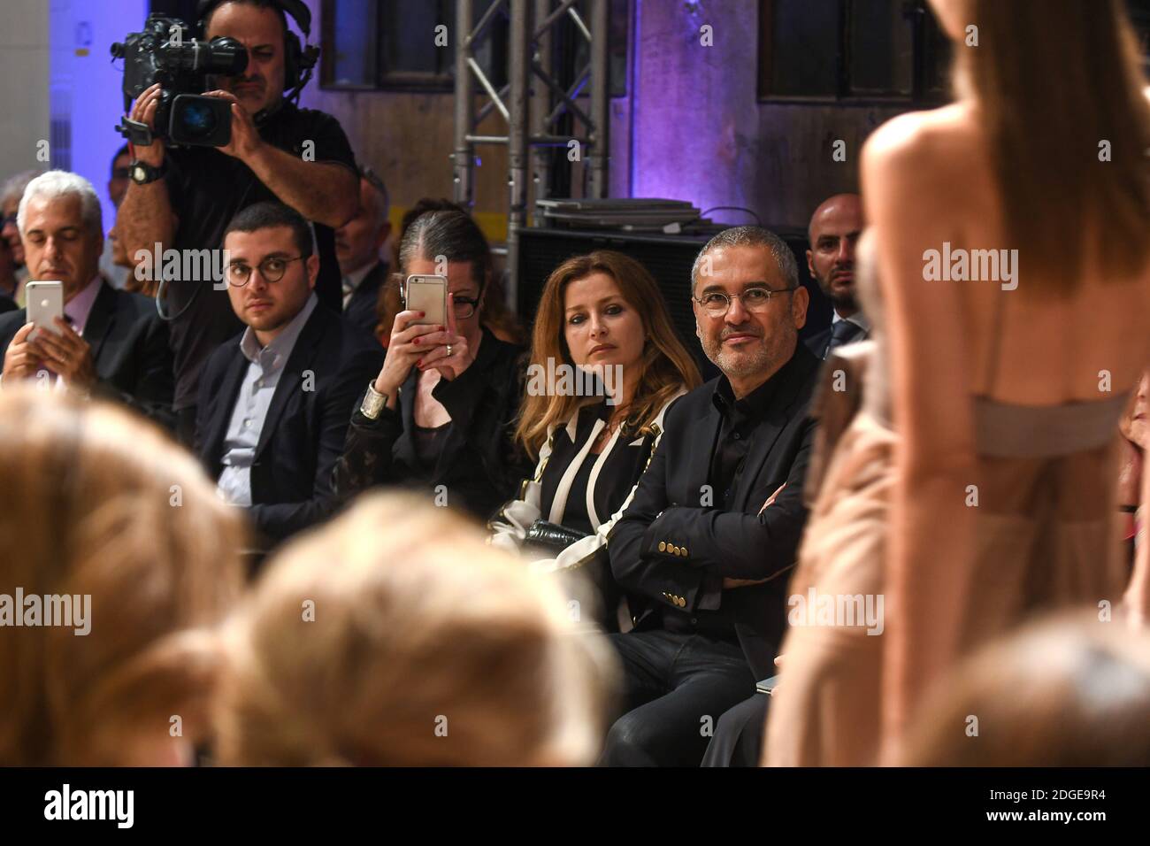 Fashion designer Elie Saab (center) and wife Claudine attend the ...
