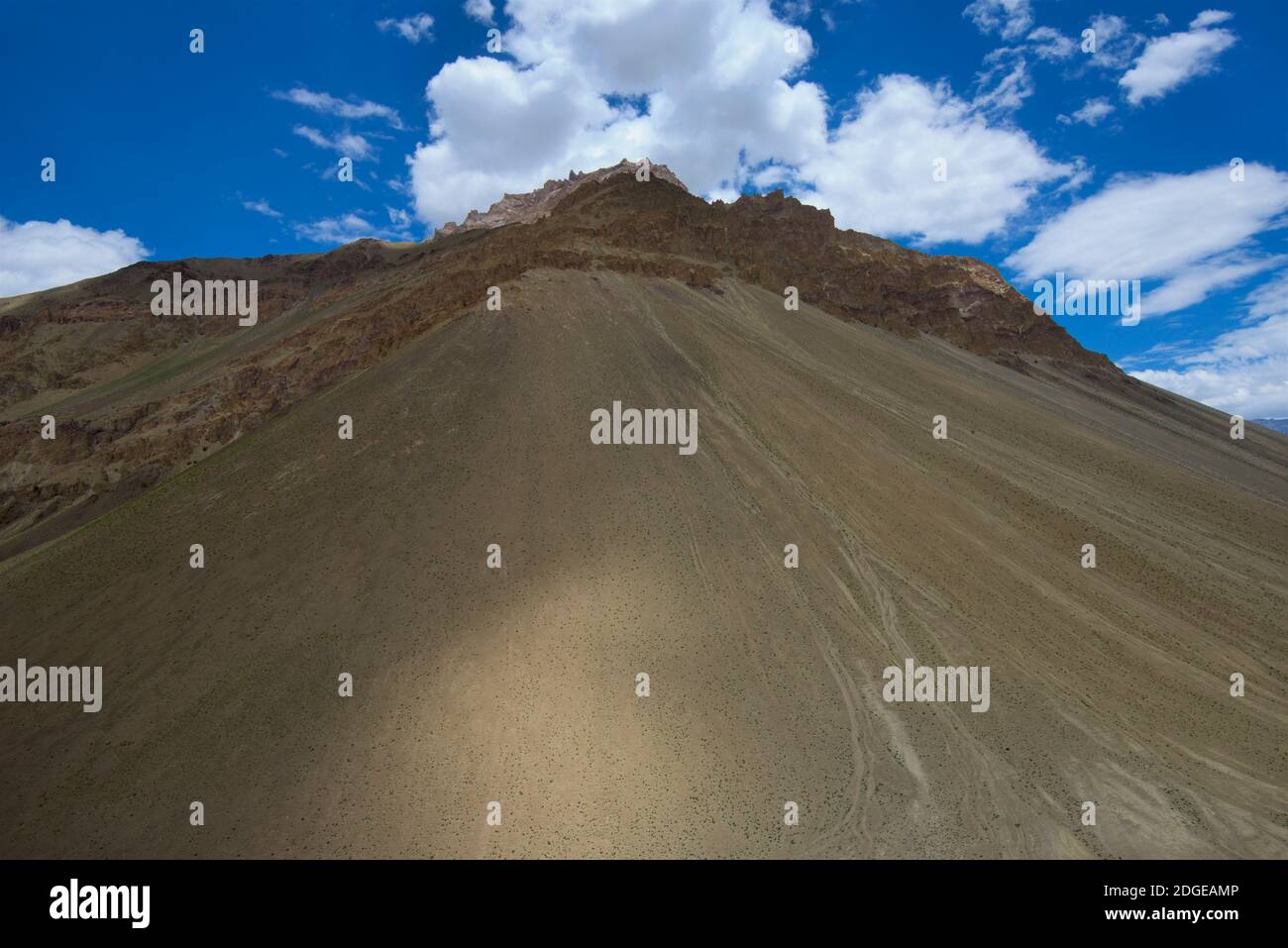 Mass movement of scree. The arid and rocky landscape around Zangla ...