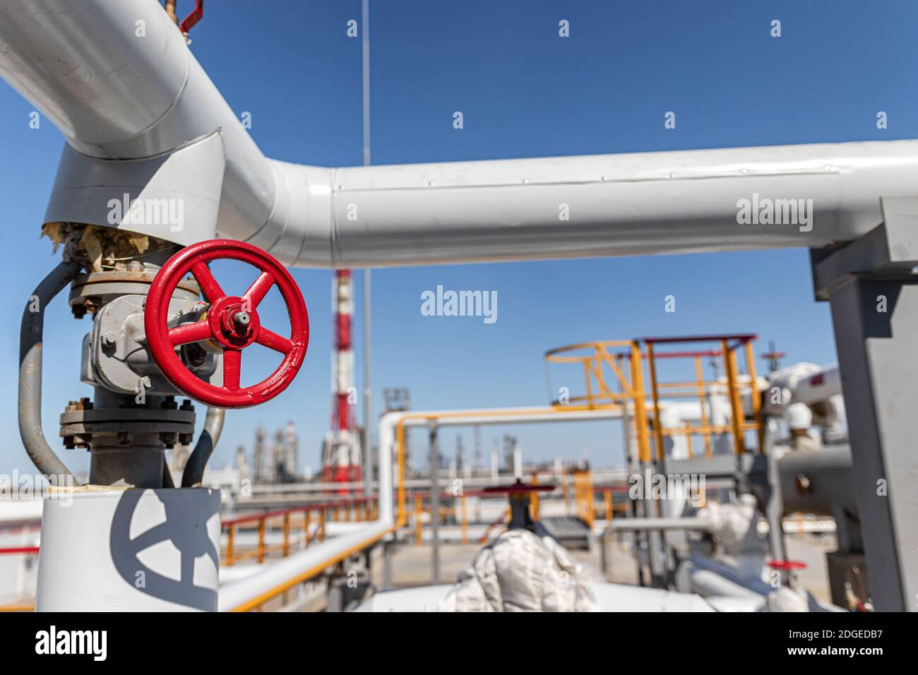 New shut-off valves with red flywheel installed on new process pipeline ...