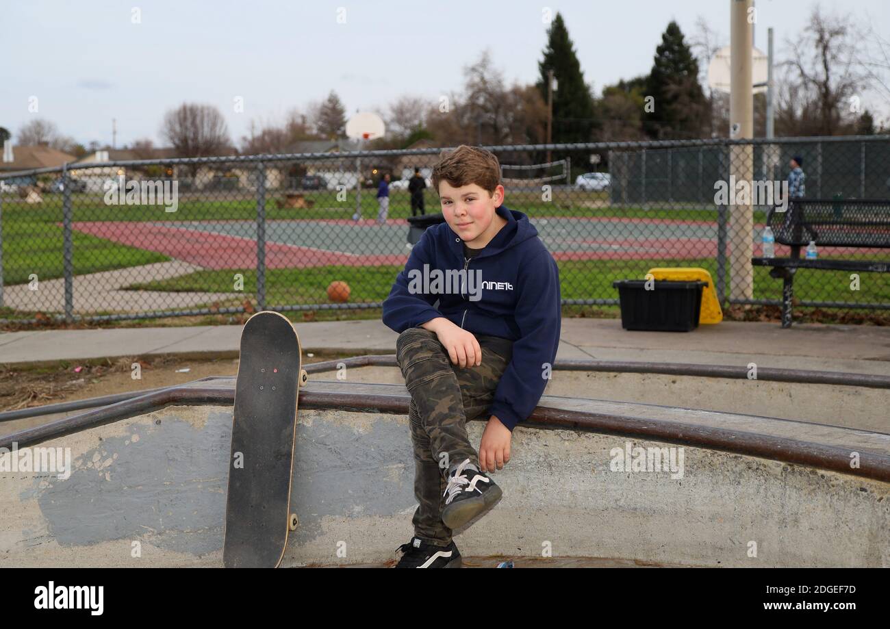 Young boys at skate park practicing Stock Photo - Alamy