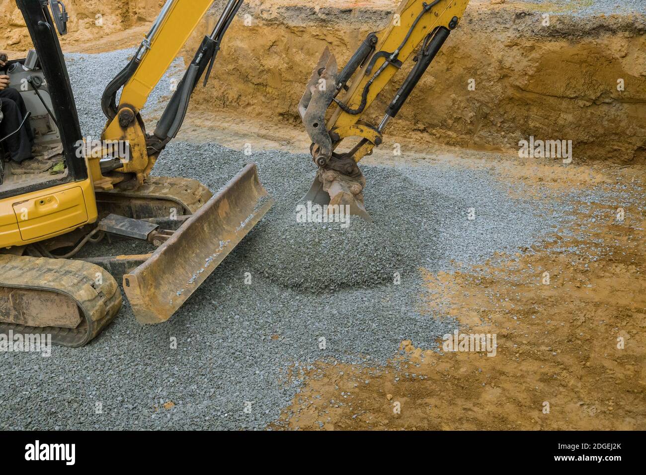 Excavation backfilling stone of foundation Stock Photo - Alamy