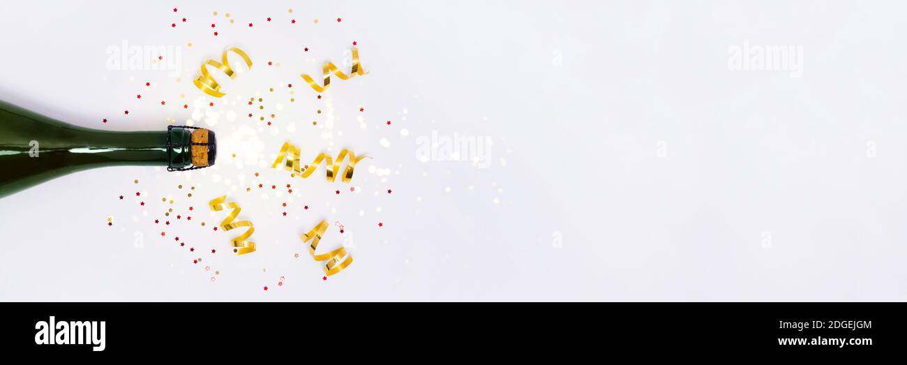 Banner with champagne bottle with golden confetti and lights on white ...