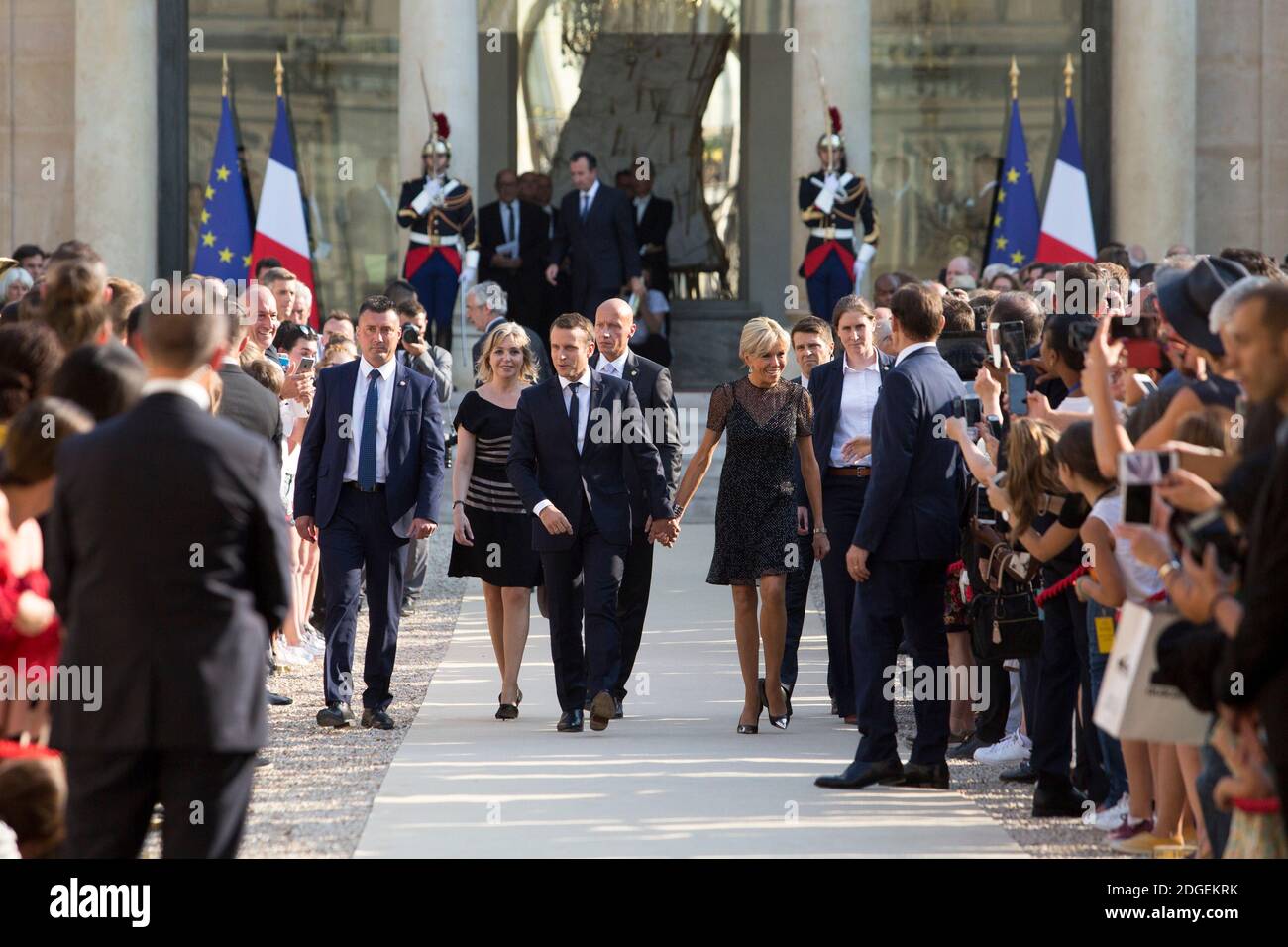 French President Emmanuel Macron and his wife Brigitte receiving ...