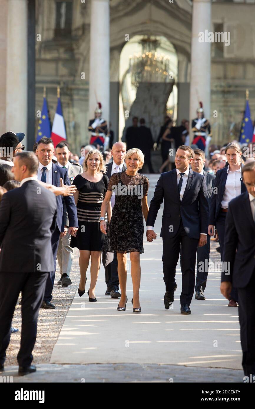 French President Emmanuel Macron and his wife Brigitte receiving ...