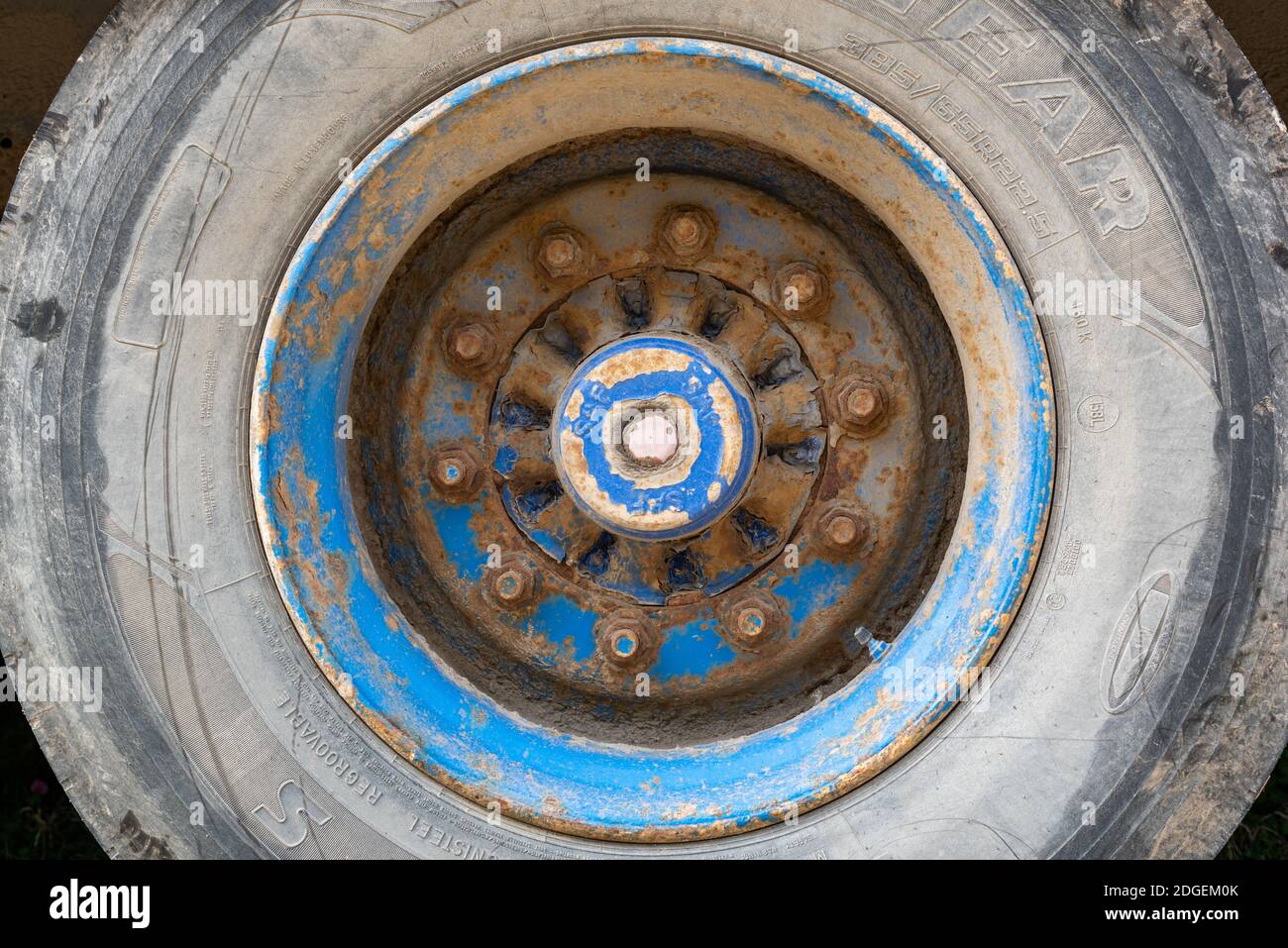 Old wheel of a truck covered with rust Stock Photo - Alamy