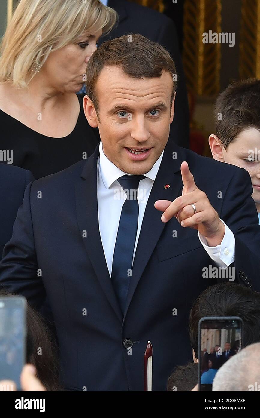 French President Emmanuel Macron and his wife Brigitte receiving ...