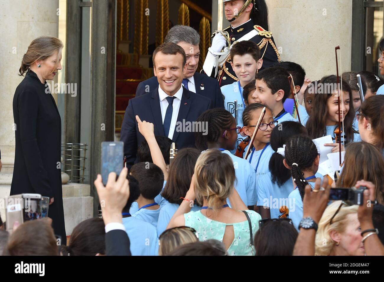 French President Emmanuel Macron and his wife Brigitte receiving ...