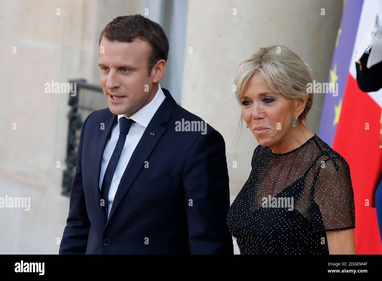 French President Emmanuel Macron and his wife Brigitte receiving ...