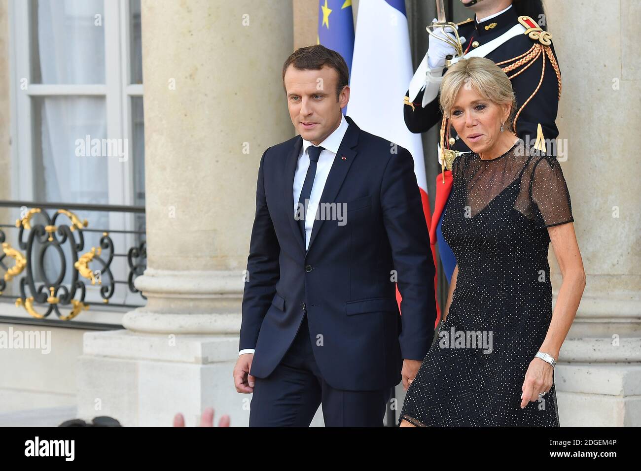 French President Emmanuel Macron and his wife Brigitte receiving ...