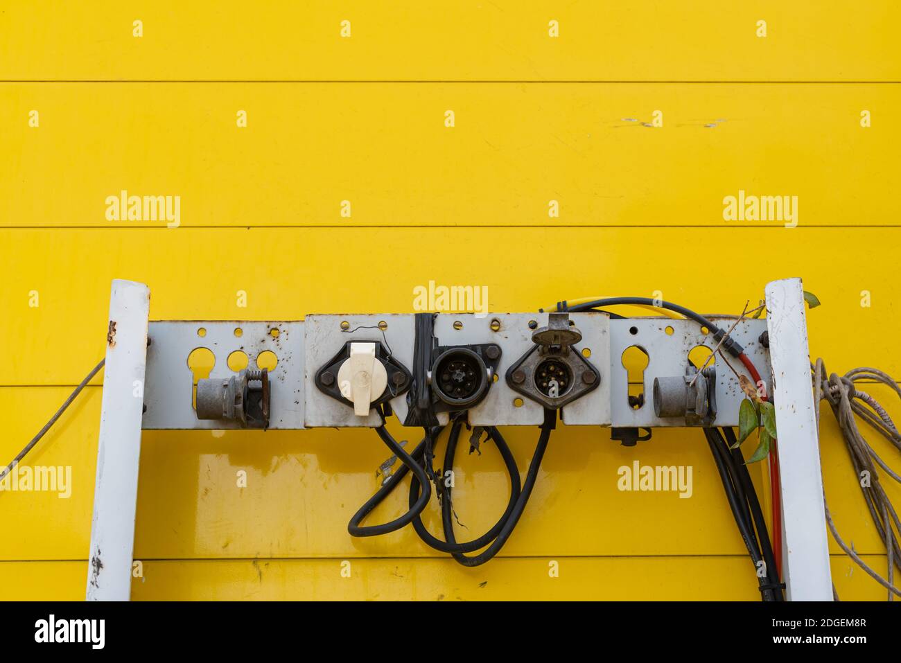 Close up of cables and power sockets on the back of bright yellow truck ...