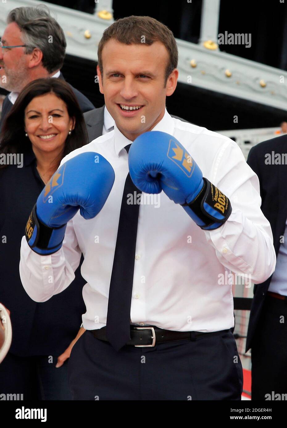 French President Emmanuel Macron spars with a boxing partner in Paris ...