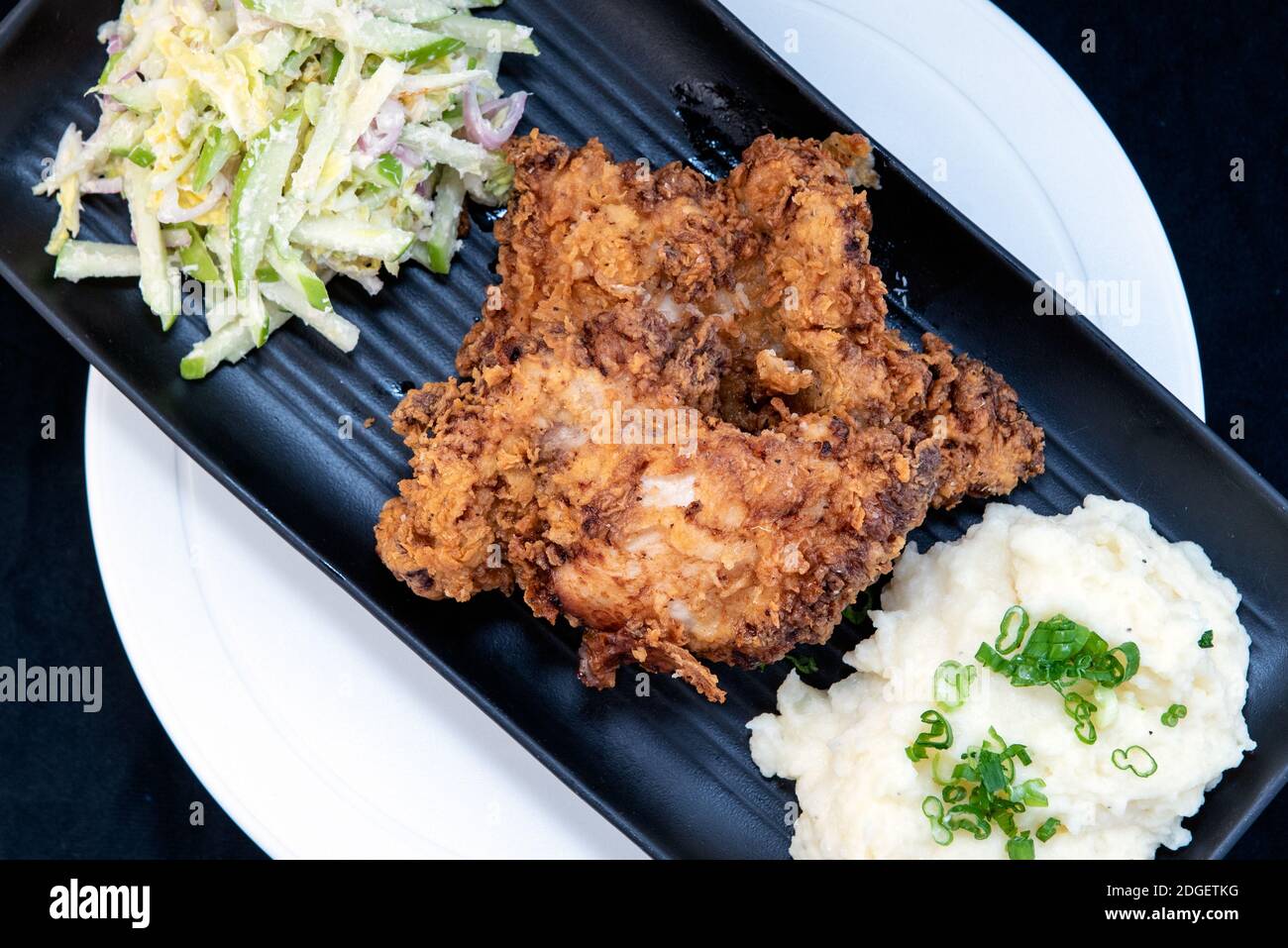 Overhead view of delicious fried chicken with mashed potatoes makes the ...