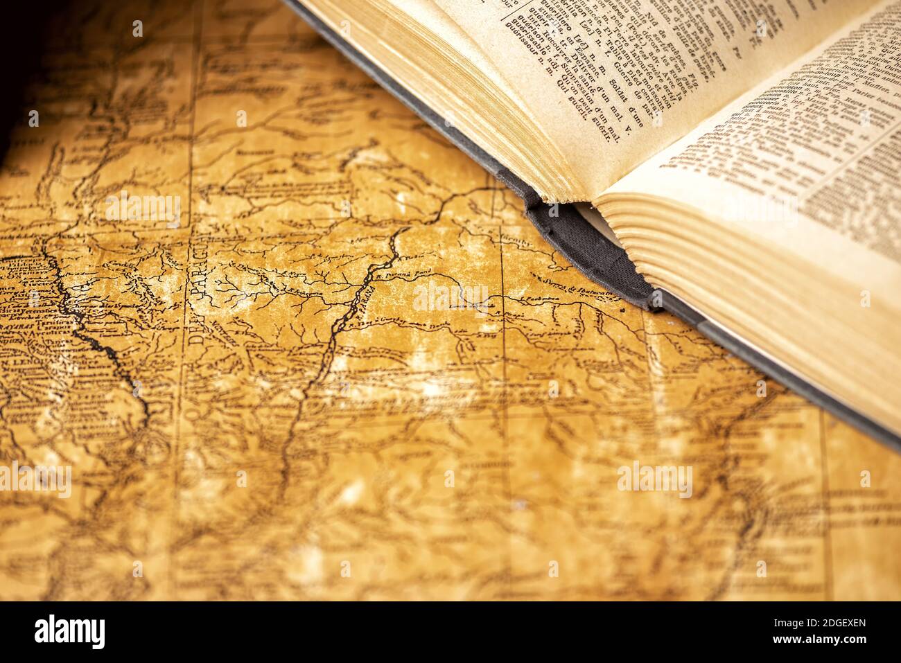Old expedition map and book Stock Photo - Alamy