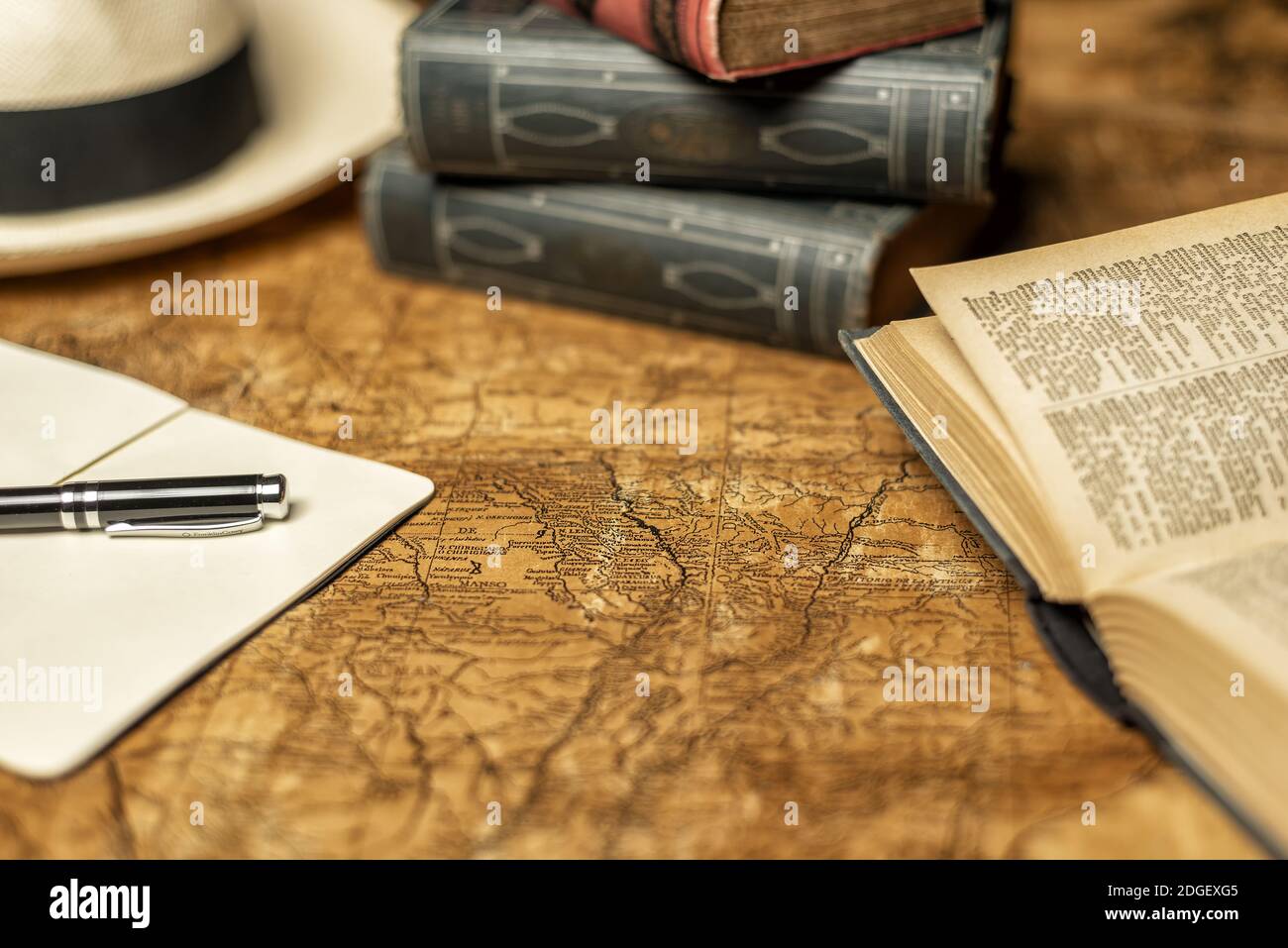 Old expedition map with notebook and other books Stock Photo - Alamy
