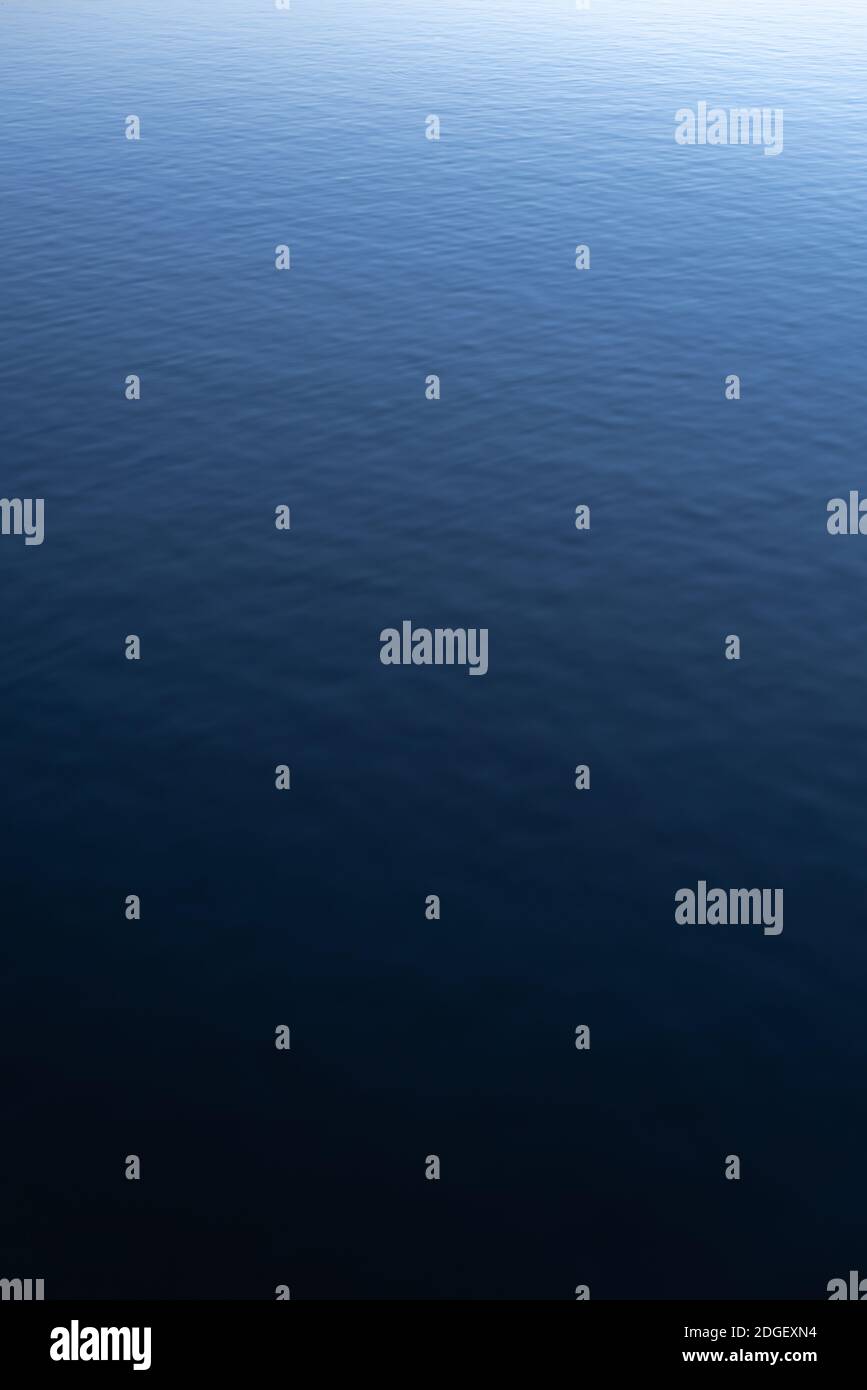 Deep blue water ripple texture vibrant monochrome with copy space for ...