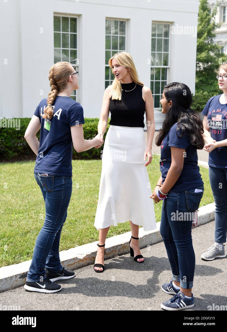 Ivanka Trump poses with students in front of the West Wing at the White ...