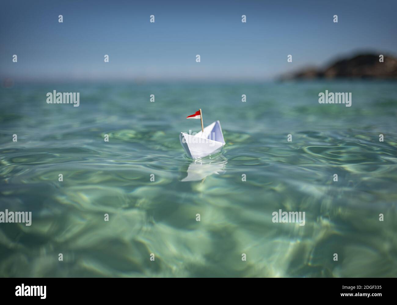 Paper Boat sailing Stock Photo - Alamy