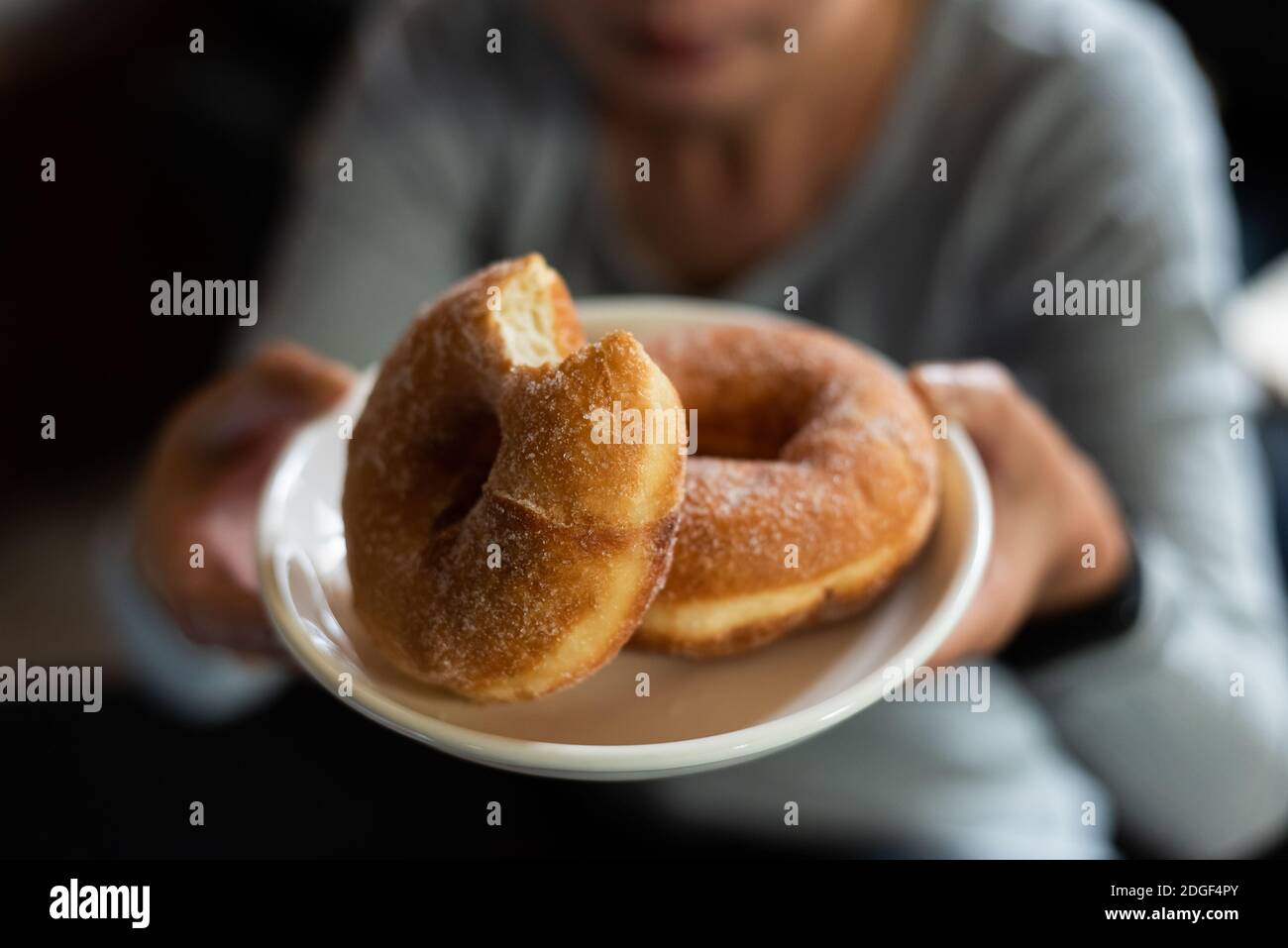 Take a donut Stock Photo - Alamy