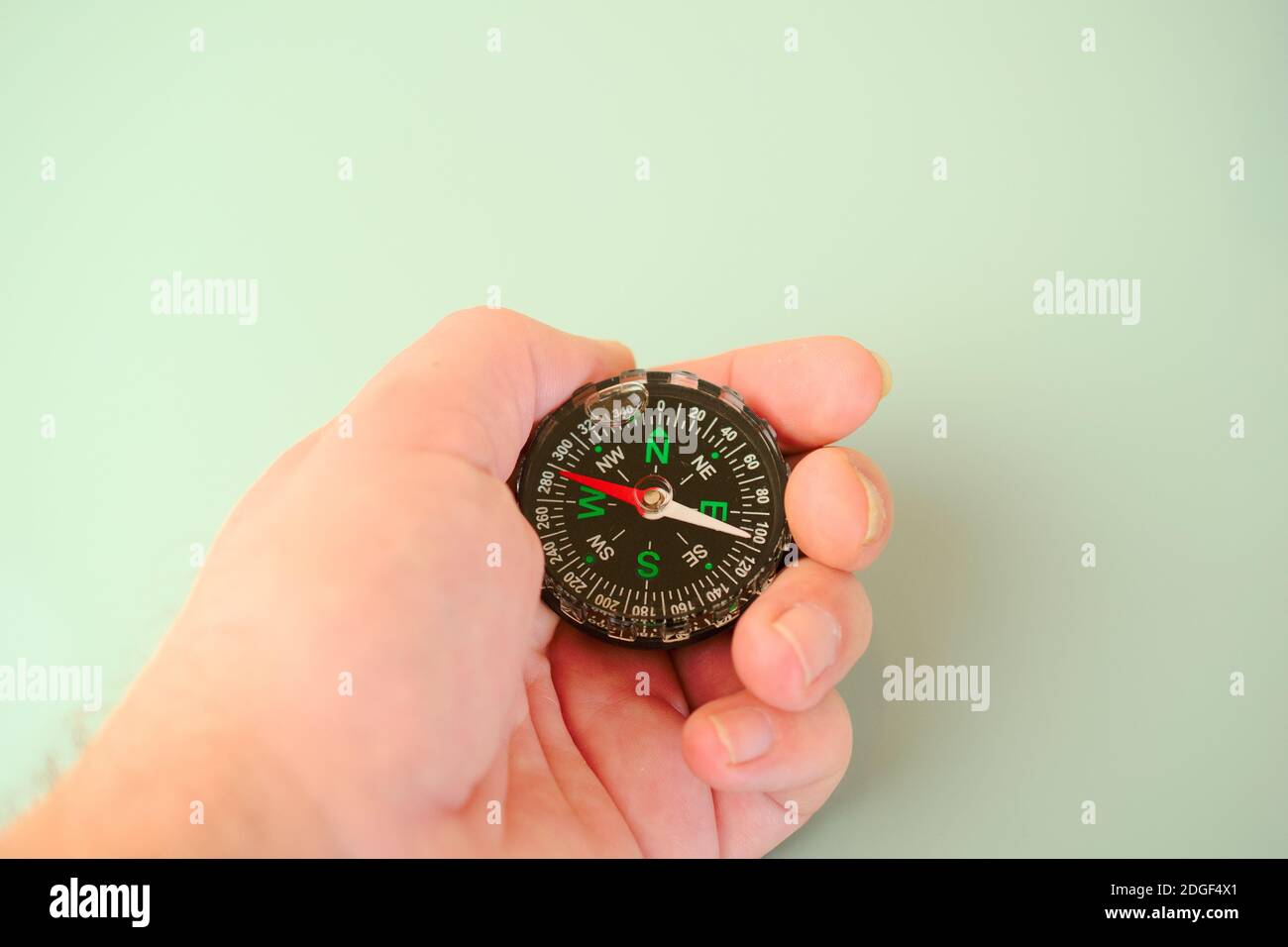 hand holding a compass Stock Photo - Alamy