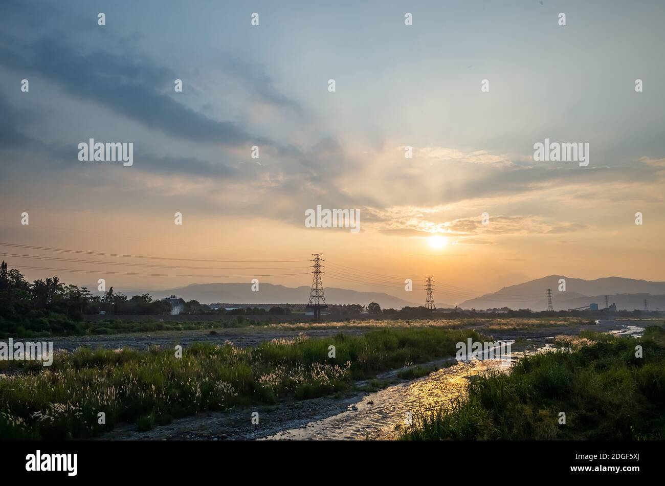 Urban sunset scenery with electronic tower Stock Photo - Alamy