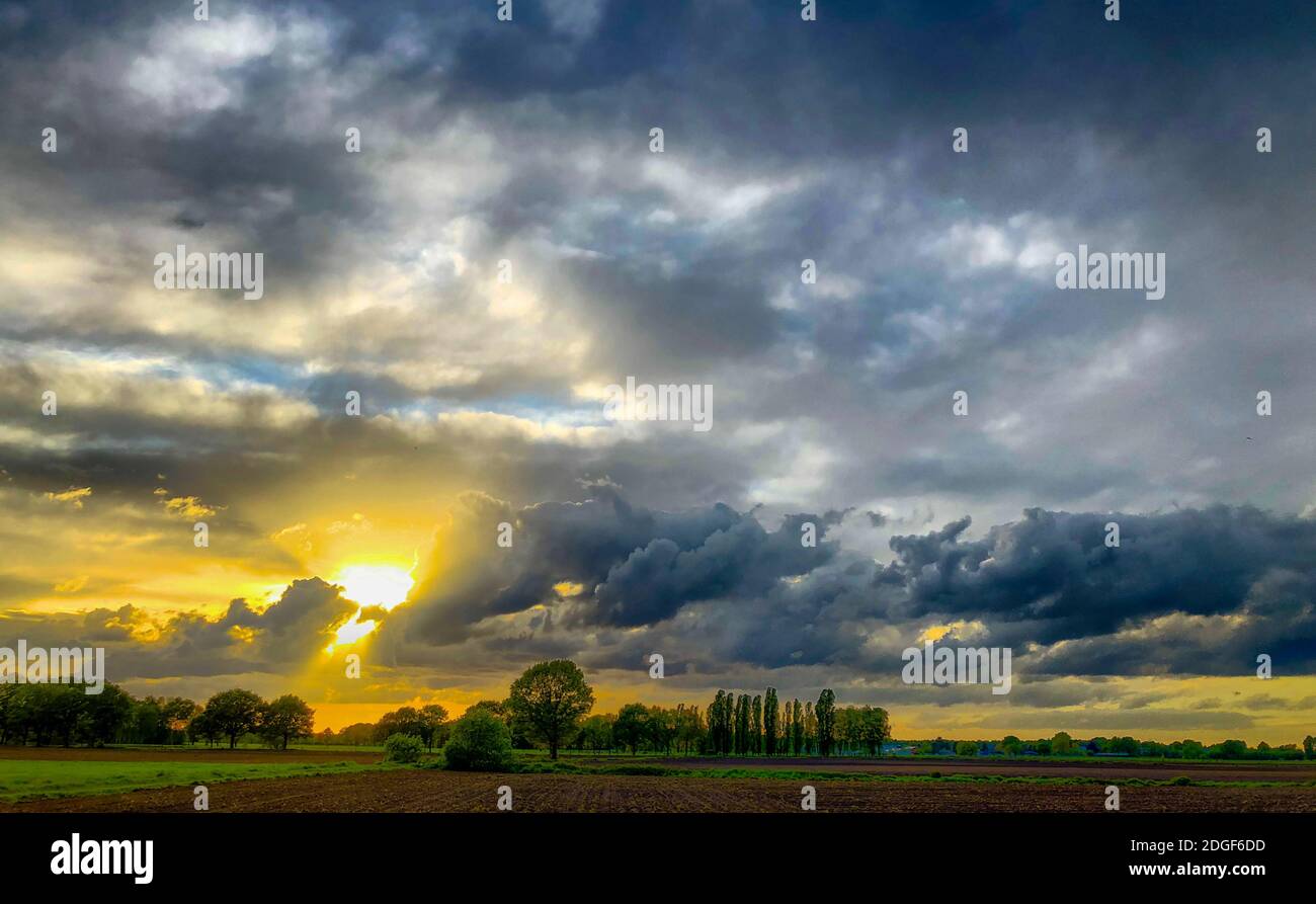 Countryside sunrise over the fields showing the dramatic colors in the ...