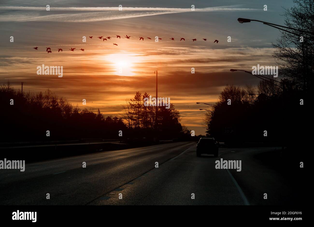 Car on road early in the morning with sunrising Stock Photo - Alamy