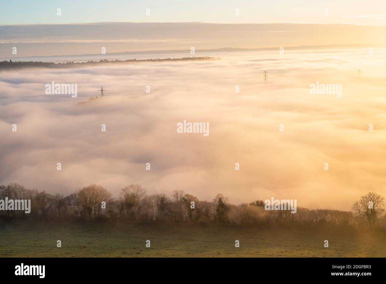 Late afternoon fog over Devizes from Roundway Hill in the Wessex Downs ...