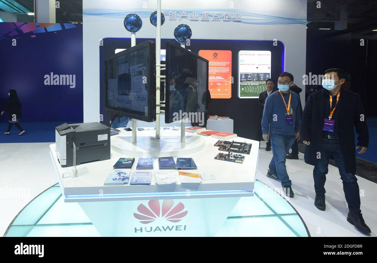 Tourists observe exhibits shown at the 24th China International ...