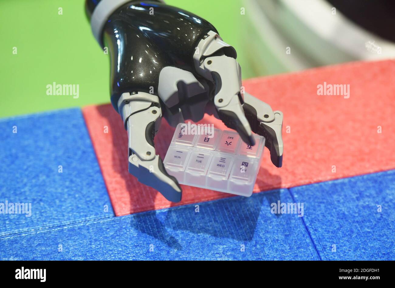 A robot hand carries cubicles at the 2020 RoboCom in Hangzhou city ...