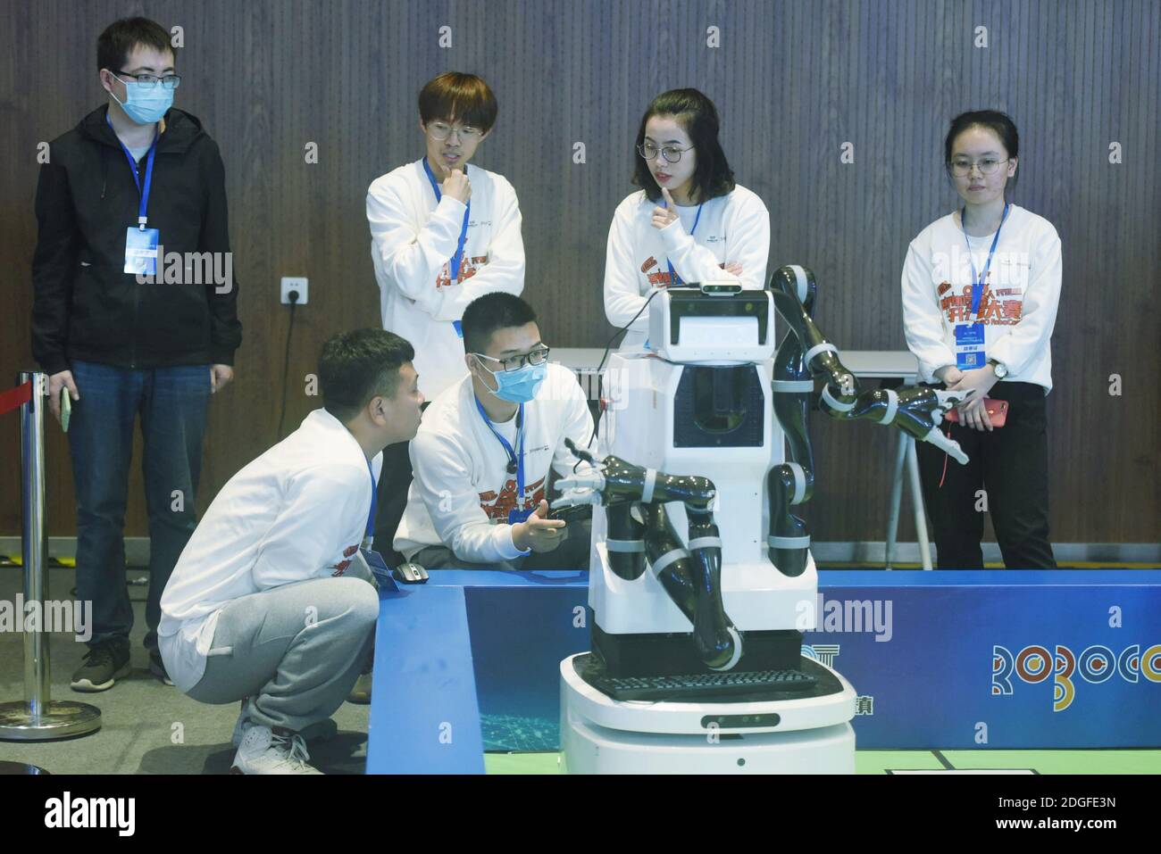 Participants operate a robot at the 2020 RoboCom in Hangzhou city, east ...