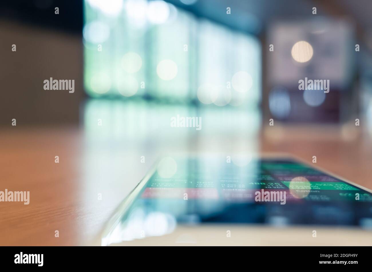 Using a mobile device to check market data Stock Photo - Alamy