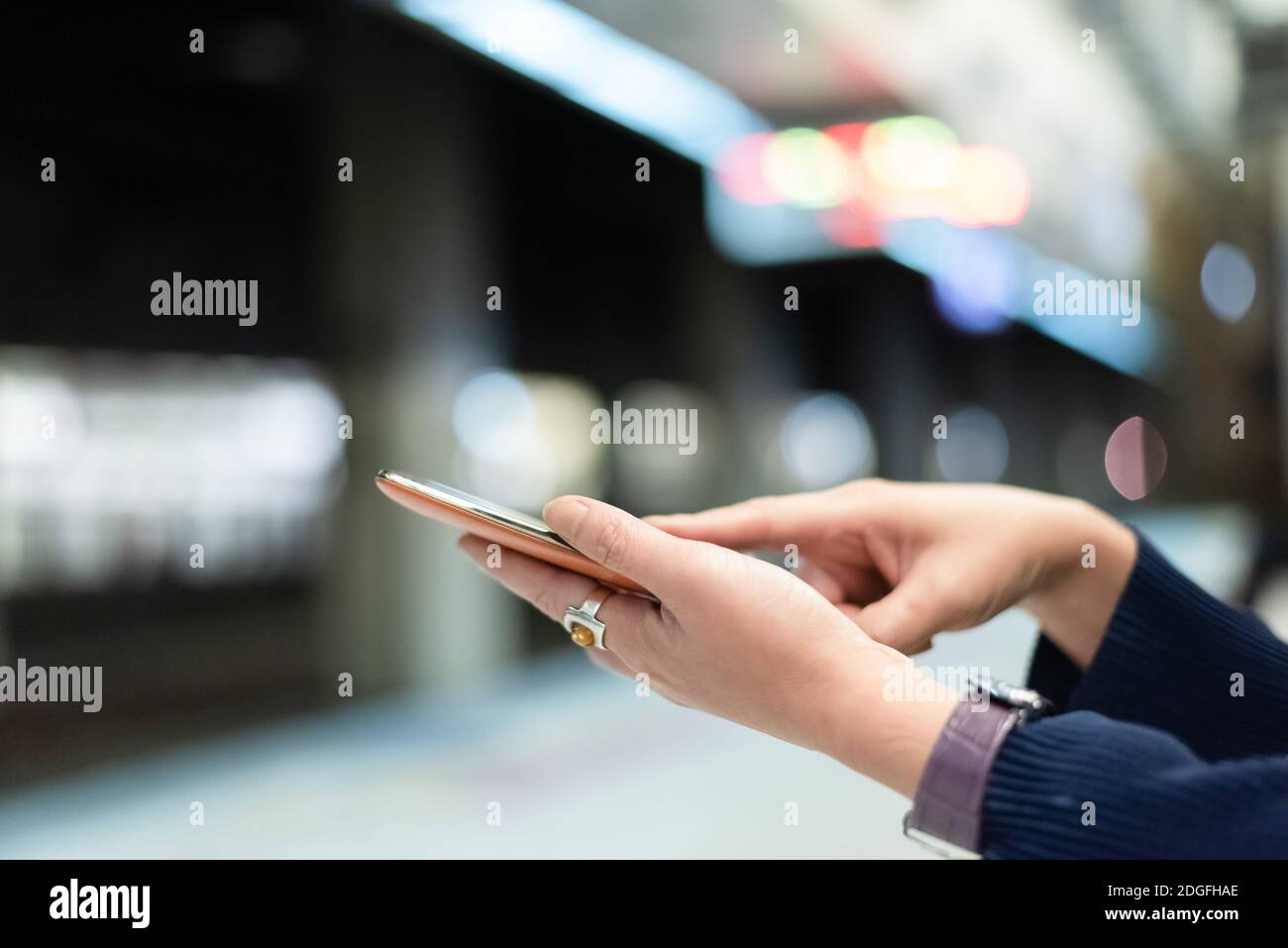 Woman using cellphone in train hi-res stock photography and images - Alamy