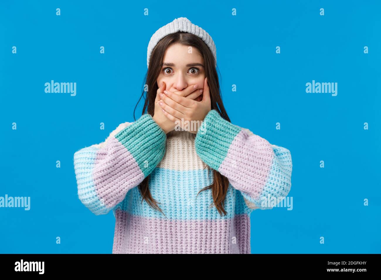 Shocked and startled attractive young woman told something bad, shut ...